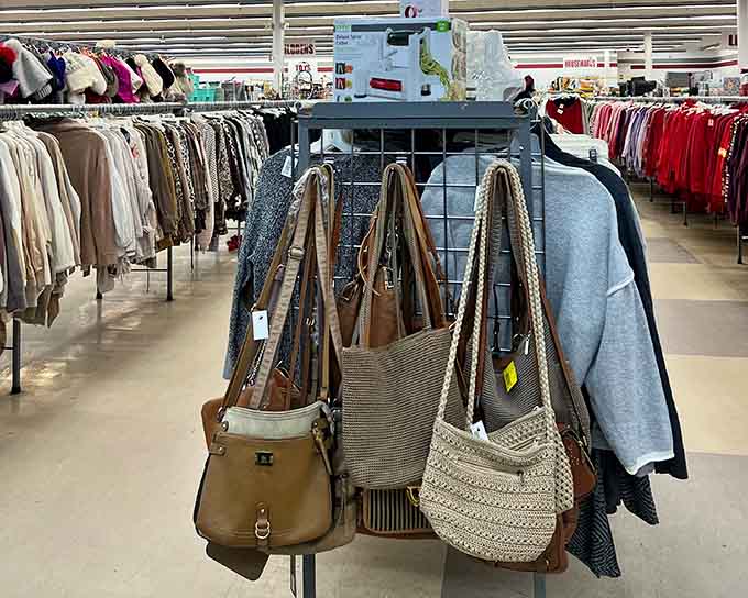 Handbags hang like fashion accessories in a department store, except these come with stories and unbeatable price tags.