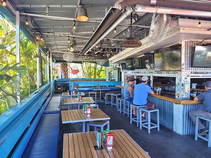 The covered patio offers breezy outdoor dining where you can enjoy grouper sandwiches in pure Florida sunshine.