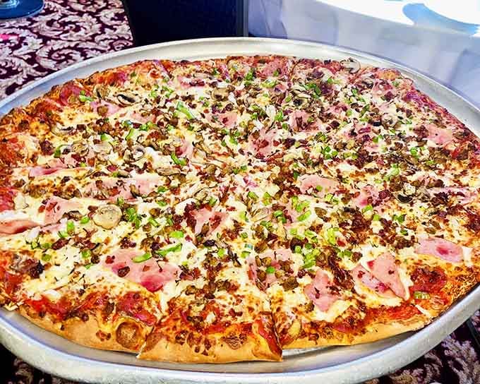 Pizza loaded with toppings from edge to edge, proving that more really is more sometimes.