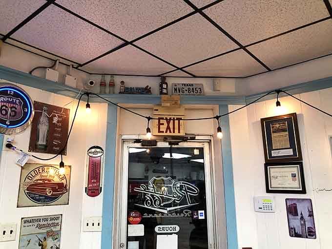 Even the exit door sports Route 66 branding, because this place commits fully to the nostalgic highway diner aesthetic.