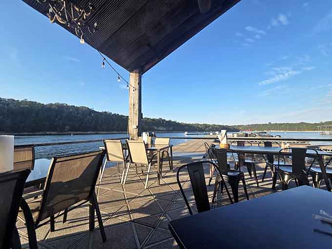 Morning light dancing across calm waters while you sip coffee at these waterfront tables beats any fancy brunch spot downtown.