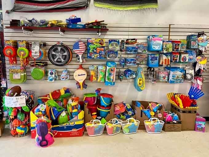 Buckets of beach toys arranged like a rainbow promise hours of entertainment for less than one restaurant meal.