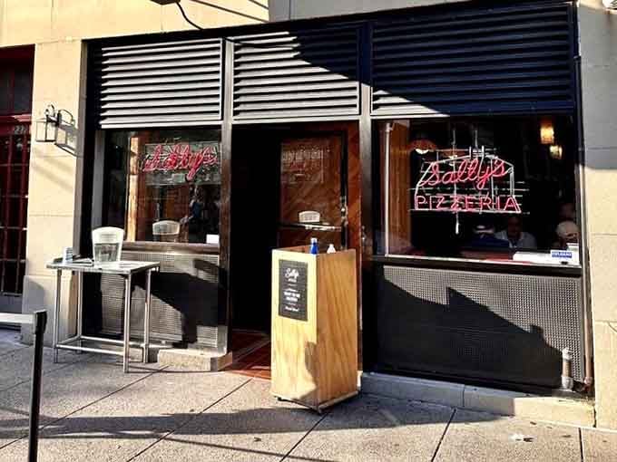 The storefront entrance beckons pizza pilgrims who've traveled from near and far for this moment.
