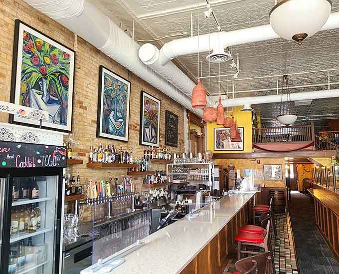 The bar area beckons with promises of perfectly mixed drinks and an impressive lineup of Spanish wines.
