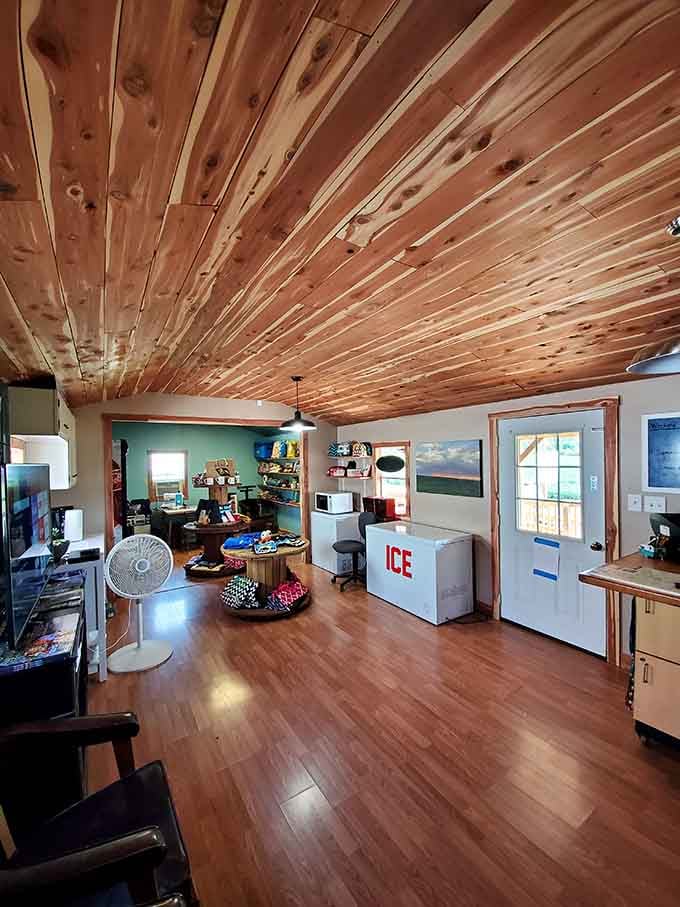 Cedar-planked ceilings and organized supplies inside show that camping comfort starts with thoughtful details and good planning.