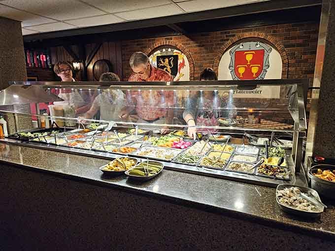 That salad bar under the German crests means you can pretend you're being healthy before the schnitzel arrives.