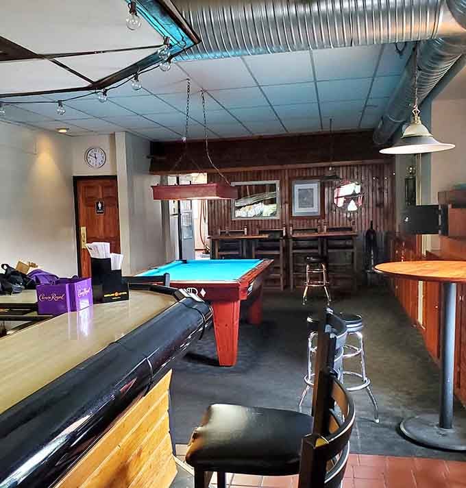 A pool table waits patiently for post-dinner entertainment, because good times don't end with dessert.