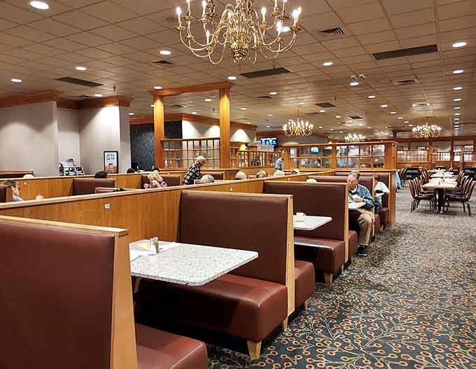 Booth seating stretches into the distance, ready to cradle you through multiple courses and inevitable food-induced contentment.