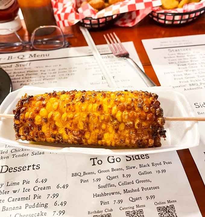 Buttery grilled corn on the cob adds a sweet, smoky side that's summer on a stick.