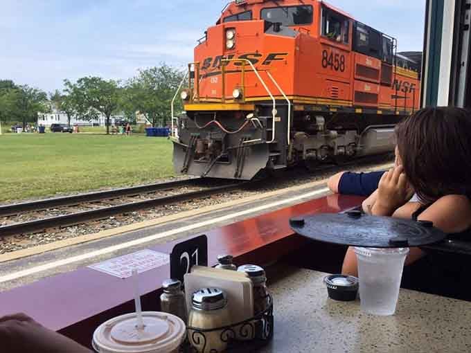 Window seats offer views of passing trains, turning an ordinary meal into entertainment that keeps children genuinely fascinated throughout.