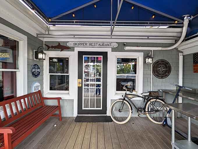 The entrance invites you in with that perfect Cape Cod porch vibe and a bicycle for atmosphere.