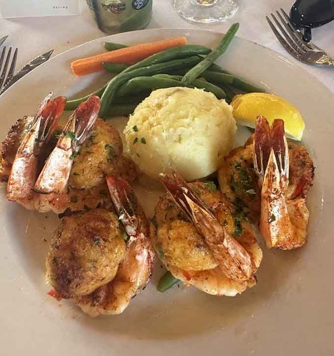Stuffed shrimp with mashed potatoes and green beans is comfort food dressed up for a night out.