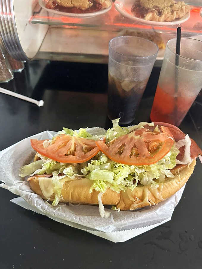 An Italian hoagie stacked high with meat, cheese, and vegetables that requires architectural engineering to eat properly.