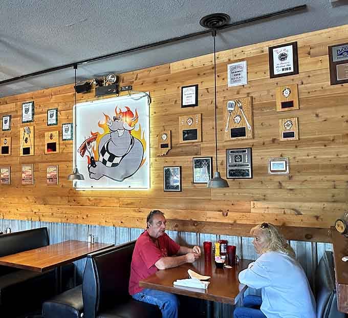 That cartoon pig surrounded by flames and awards tells you everything about Squealers' competitive barbecue spirit.