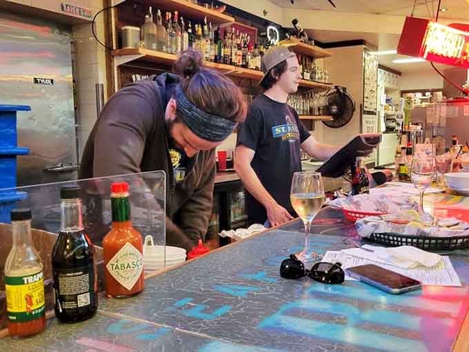 The hardworking crew behind the counter, turning fresh catches into memorable meals with skill and genuine care.
