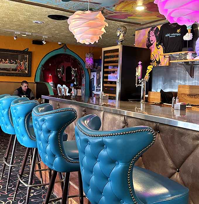 Turquoise bar stools that look like they belong in a retro lounge, proving seating can be functional and fabulous.