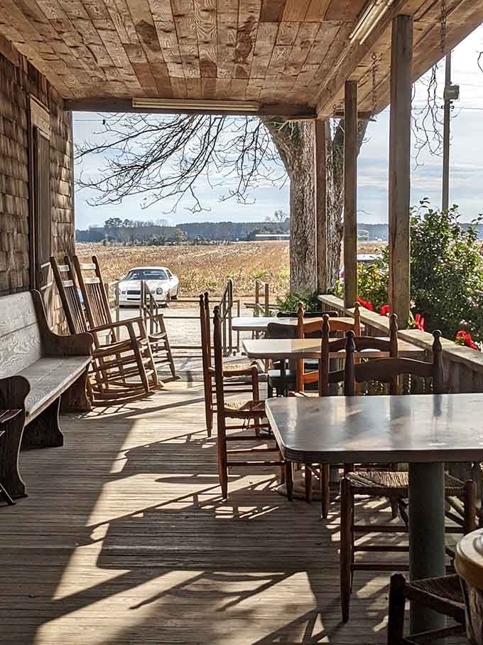 The front porch offers views of farmland and rocking chairs, because rushing through this experience would be criminal.