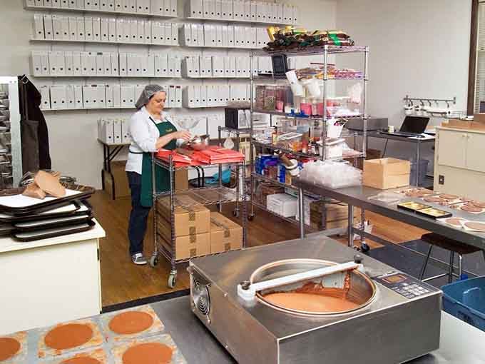 Behind the scenes, dedicated chocolatiers transform raw ingredients into edible art with focus and genuine care for their craft.