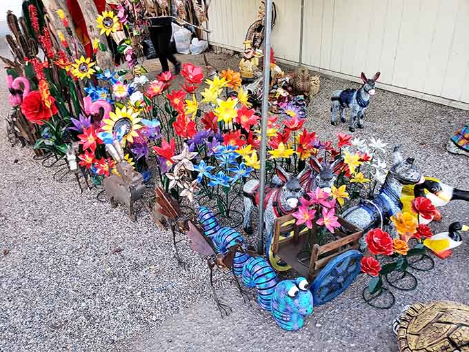 Metal garden art blooms eternally in the desert heat, no watering required for this colorful yard transformation.