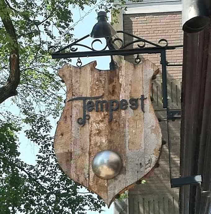 The rustic wooden sign hanging outside looks like it washed ashore from a New England fishing village, weathered and wonderful.