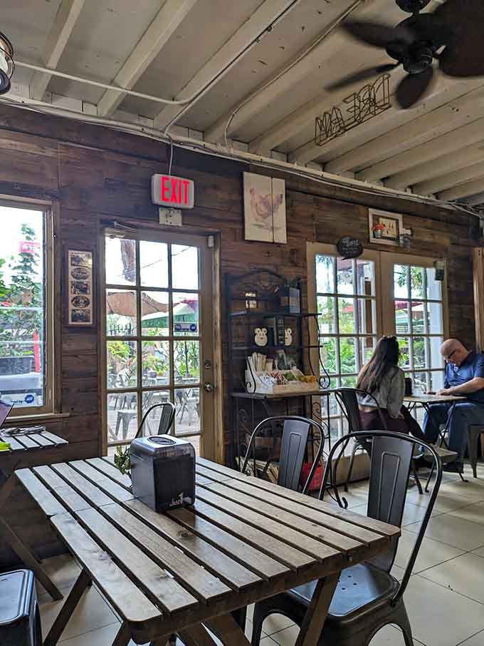 French doors frame the garden view while exposed beams overhead remind you that good design never goes out of style.