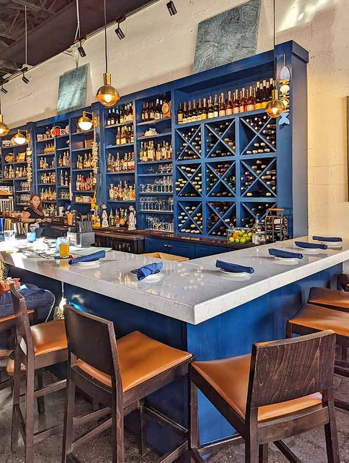 That blue shelving stocked with spirits and wines promises the perfect pairing for your seafood feast.
