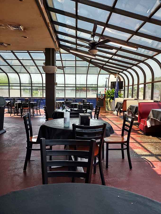 The glass-roofed atrium floods the dining room with natural light, making your massive meal look absolutely Instagram-worthy.