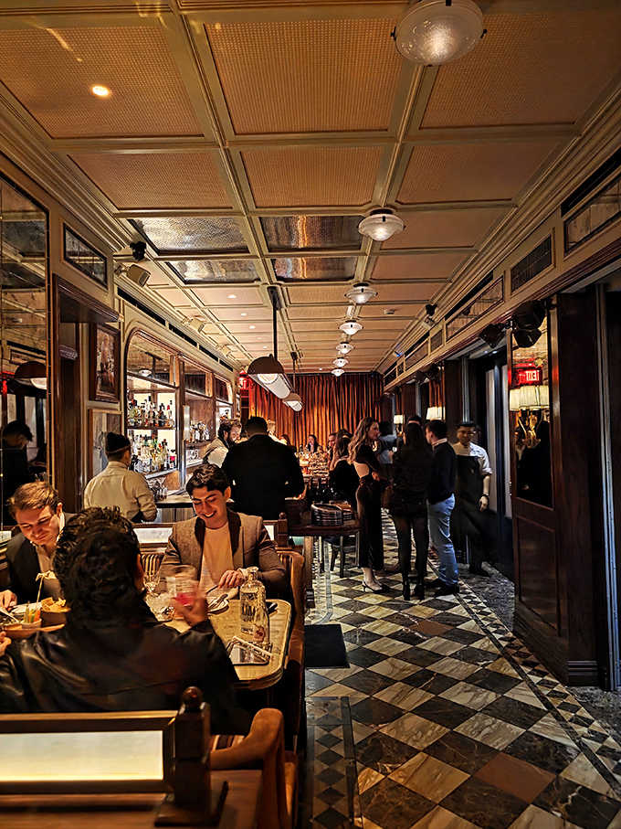 The dining room buzzes with energy as guests settle into an evening of exceptional food and that special New York atmosphere.