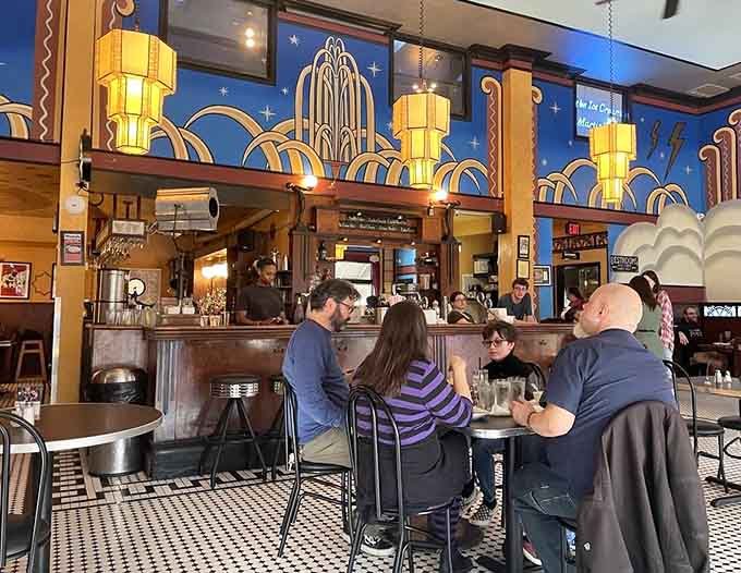 Those checkered floors and towering light fixtures prove that eating comfort food deserves a spectacular backdrop every single time.