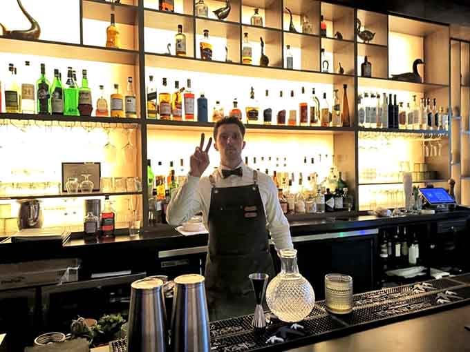 Behind every great cocktail stands a skilled bartender ready to craft your next favorite drink with precision.