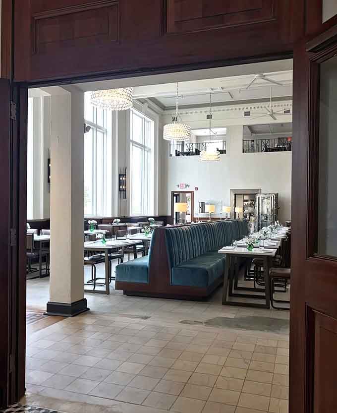 The grand entrance with its original "Bank of Washington" inscription reminds you this building has stories to tell beyond tonight's menu.