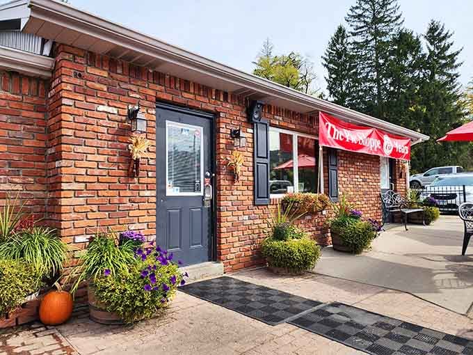 Autumn decorations frame the entrance like nature's way of saying "Come in, we've got pumpkin everything waiting inside."