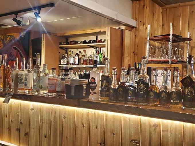 The bar glows with warm lighting and serious whiskey selection, ready to complement whatever beast you're about to devour.