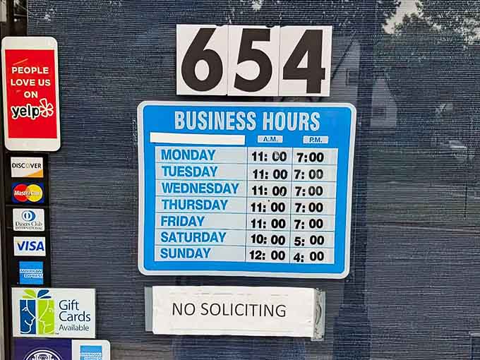 Business hours posted clearly, so you can plan your escape from reality at your earliest possible convenience.