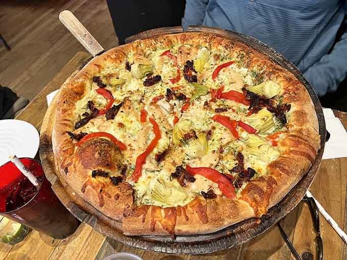 Artichoke hearts and roasted red peppers make this pesto pizza a vegetarian's dream come true.