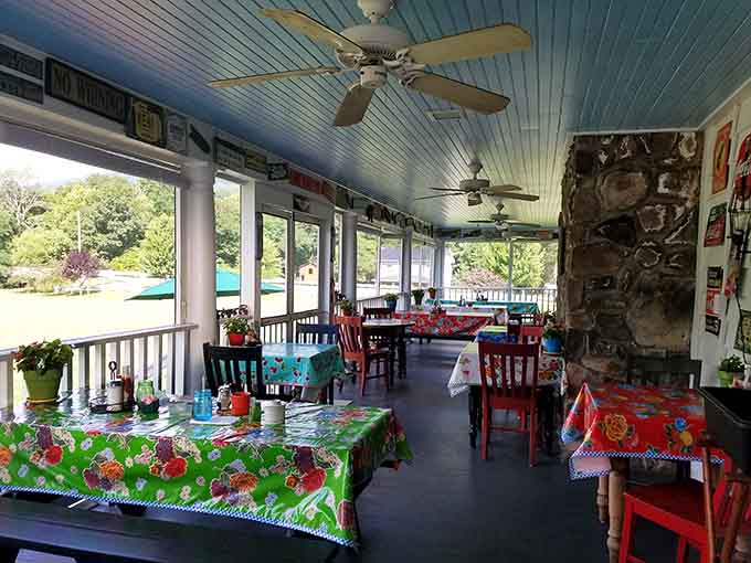 Colorful tablecloths on the porch promise leisurely meals with mountain breezes as your dining companion.