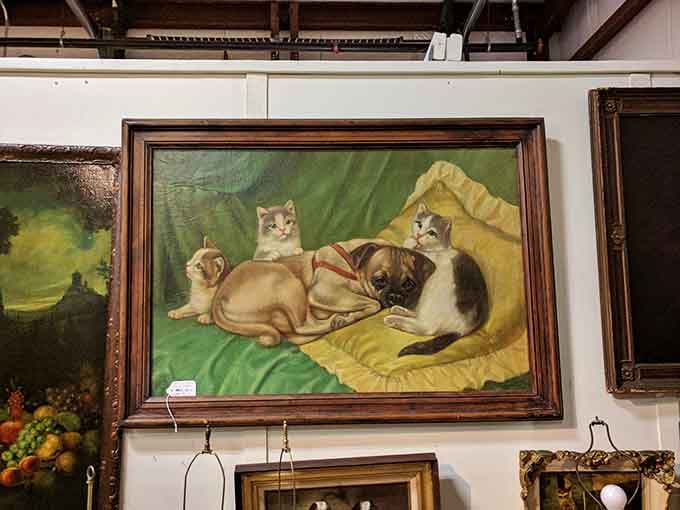 Oil paintings featuring cats and dogs in domestic harmony &ndash; proof that peaceful coexistence was possible in simpler times.