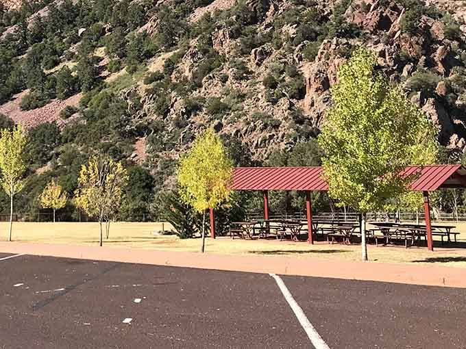 Shaded picnic pavilions offer respite beneath towering pines, where lunch tastes better surrounded by mountain majesty.