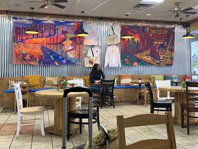 A solo diner enjoys their meal surrounded by eclectic art, proving this spot works for any dining occasion.