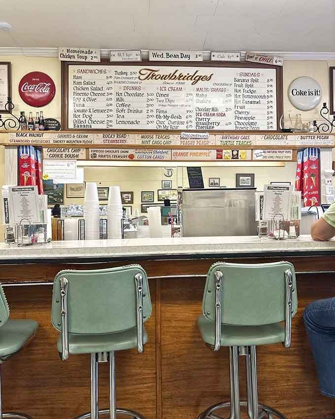 Classic Coca-Cola signs and vintage charm create an atmosphere that Instagram filters desperately try to replicate and fail.