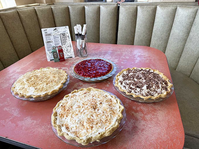 Homemade pies lined up like edible artwork, each one promising the kind of sweetness that makes road trips worthwhile.