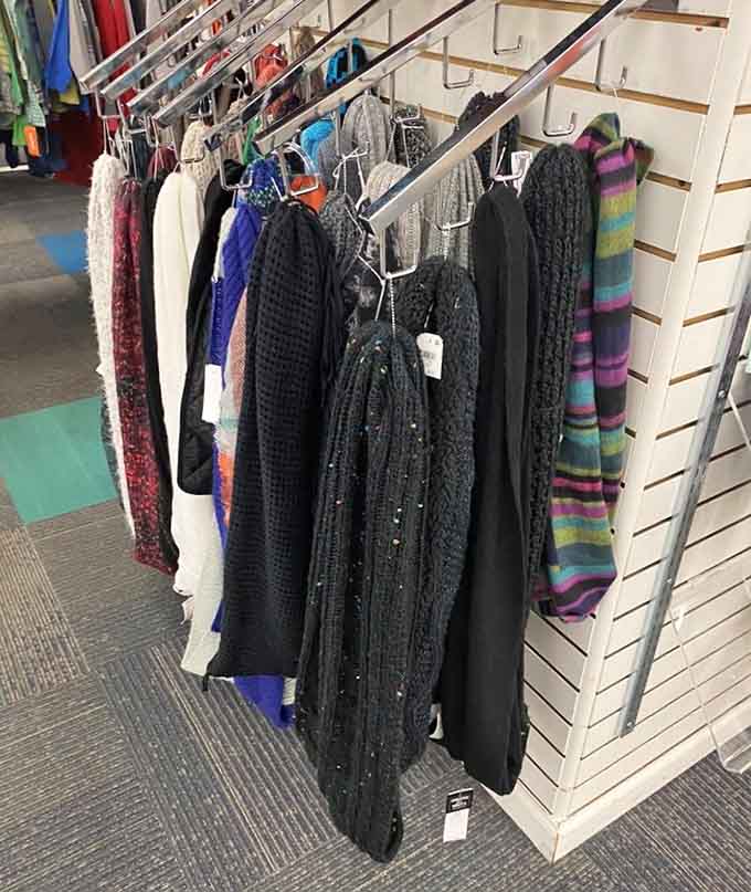 Scarves drape elegantly, each one a fashion statement that never made it to its intended destination or wearer's neck.