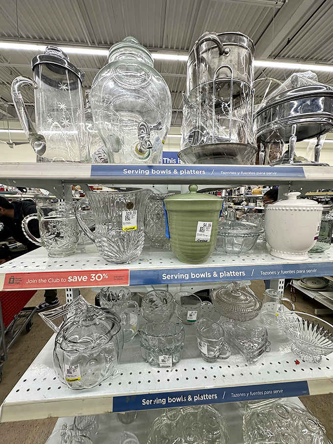 Crystal pitchers and vintage glassware gleaming under the lights, fancy enough for company at everyday prices you'll actually love.