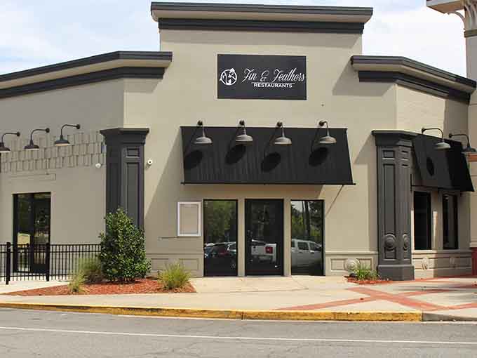 Fin & Feathers Restaurant's clean exterior promises the kind of seafood and steaks that keep locals coming back religiously.