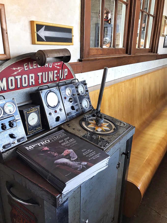 Vintage automotive diagnostic equipment reminds diners this building once fixed cars instead of serving exceptional meals.