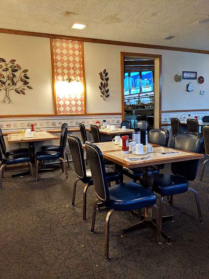 The dining room extends beyond the counter, offering cozy table seating where families have been making breakfast memories for decades.