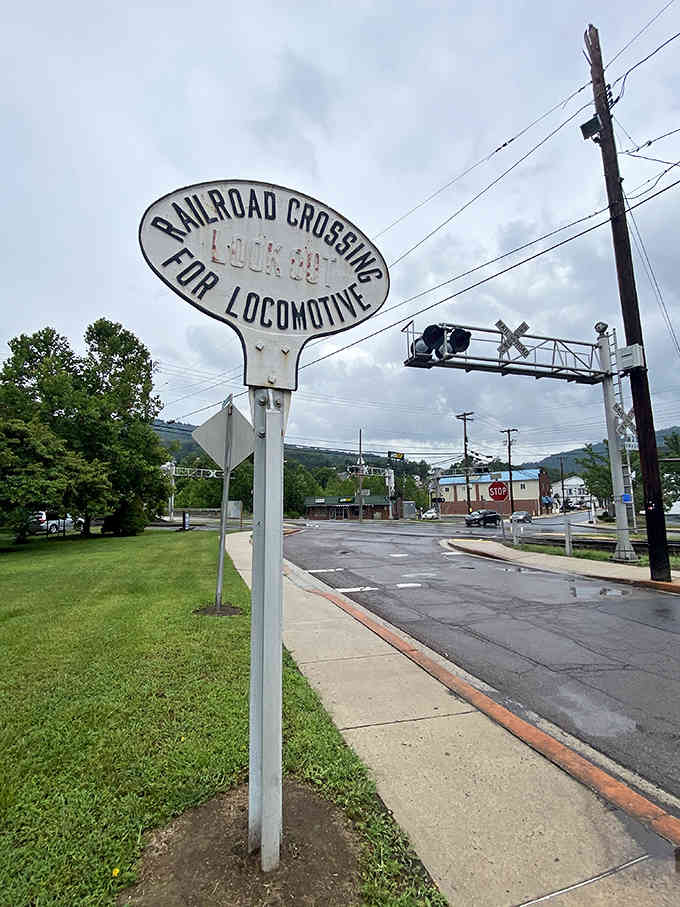 That vintage railroad crossing sign isn't just decoration; it's a reminder of when this junction truly meant something big.