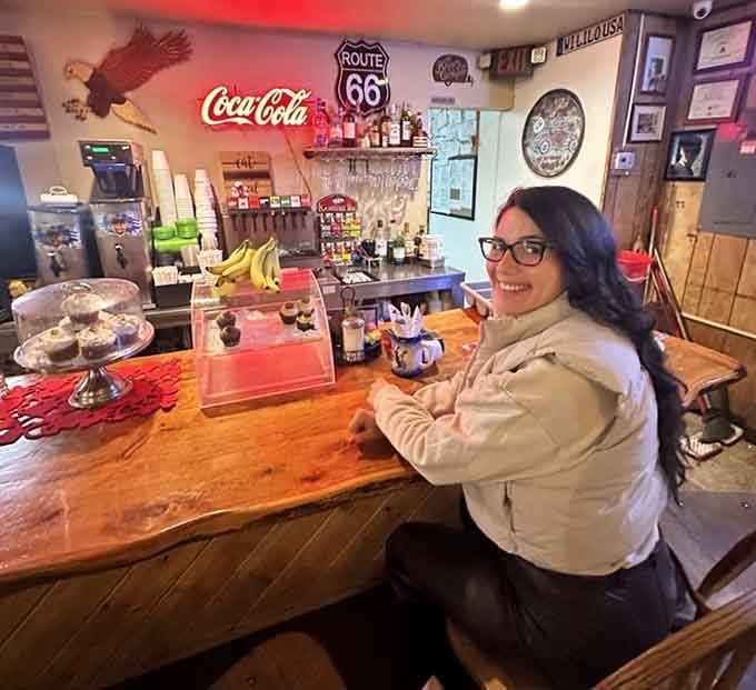 A satisfied customer at the counter proves that great food creates genuine smiles, not just Instagram moments.