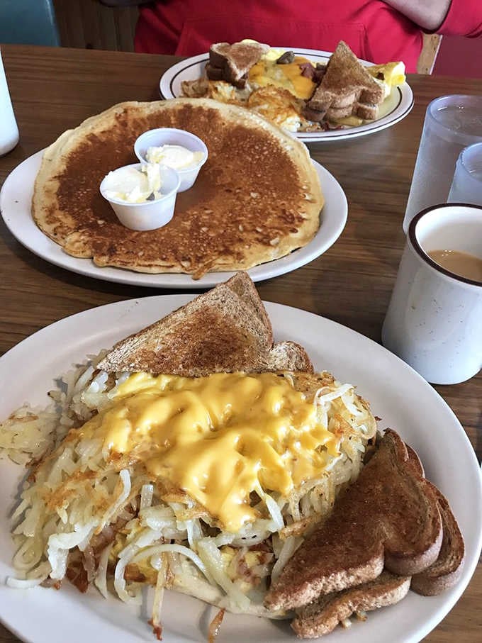 Massive pancakes and hash browns covered in cheese sauce, because moderation is overrated on vacation days.