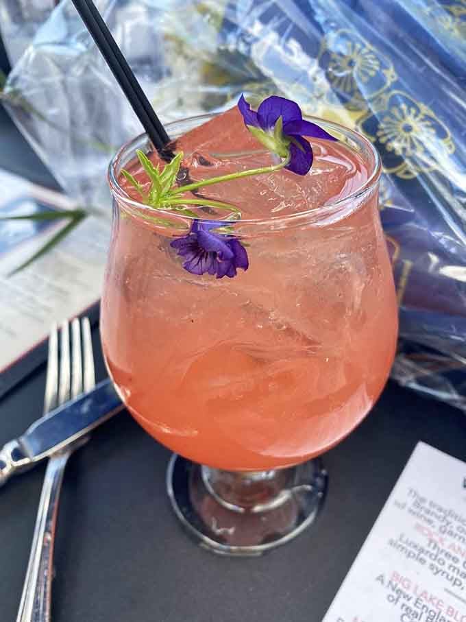 That beautifully garnished cocktail with edible flowers is almost too pretty to drink, but you absolutely should anyway.